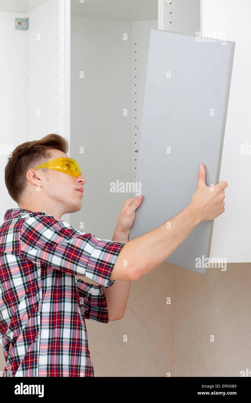Assembling furniture hi-res stock photography and images - Alamy