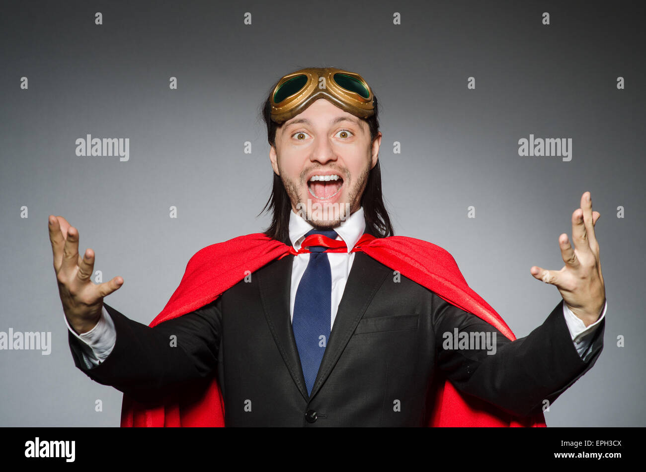 Superman concept with man in red cover Stock Photo - Alamy