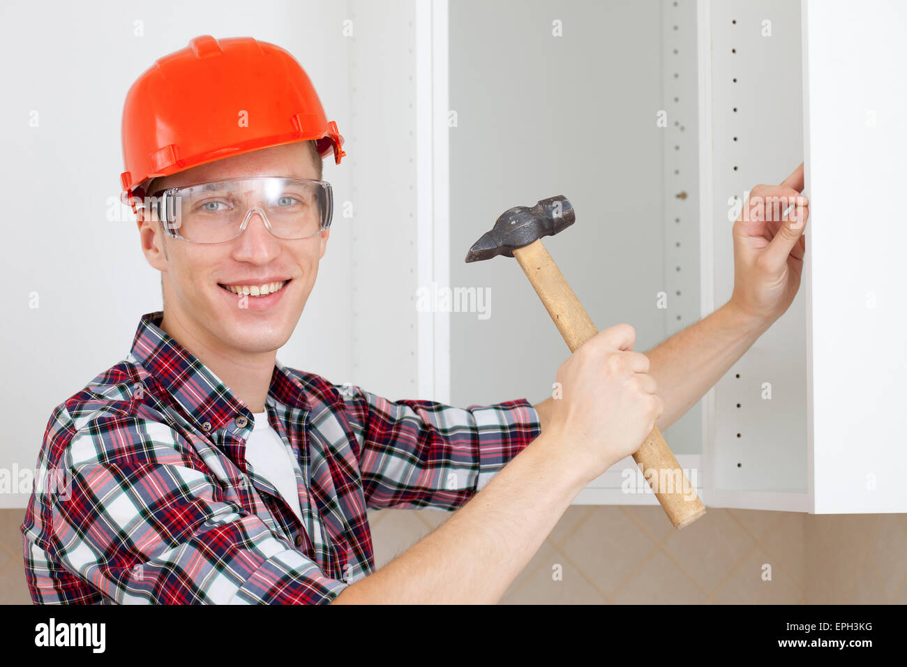 worker with a hammer Stock Photo - Alamy