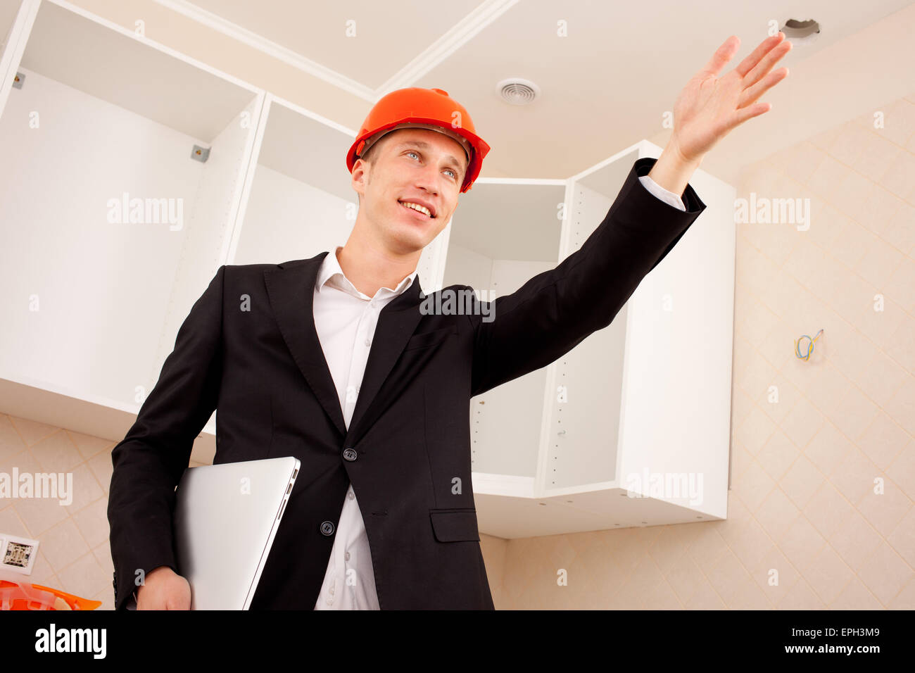 Engineer indicates the direction of hand Stock Photo - Alamy