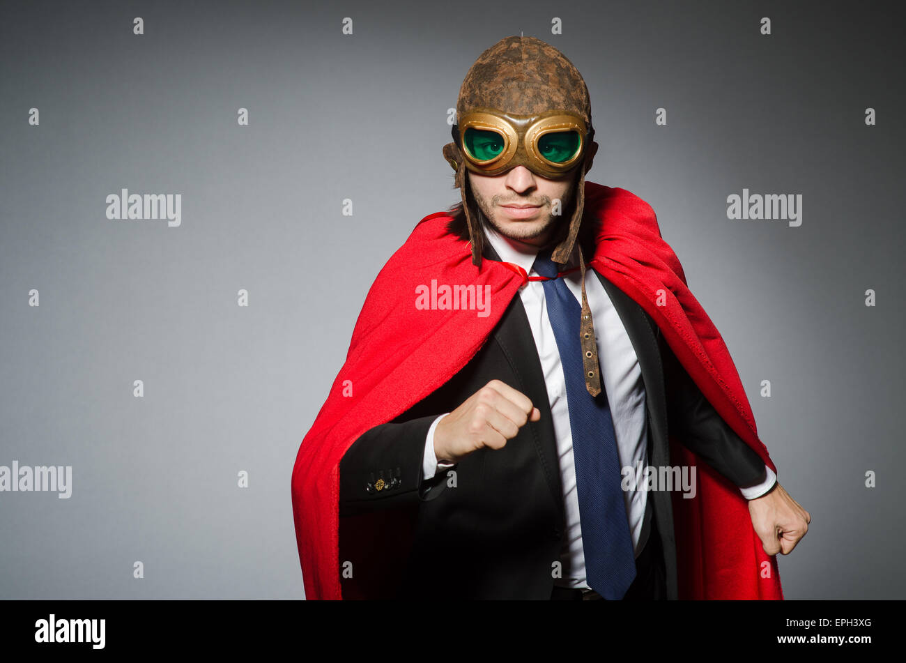Superman concept with man in red cover Stock Photo - Alamy