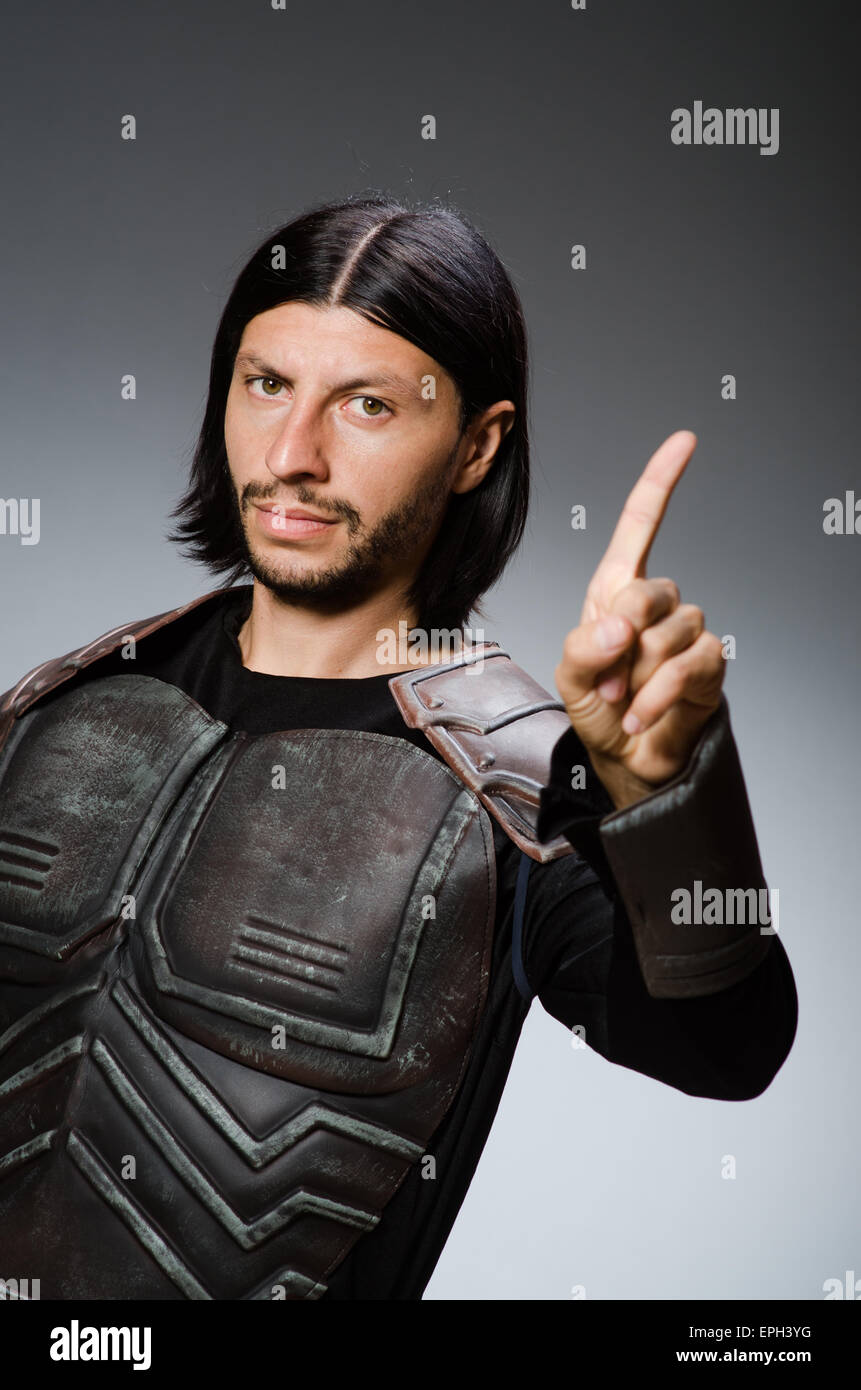 Angry warrior against dark background Stock Photo - Alamy