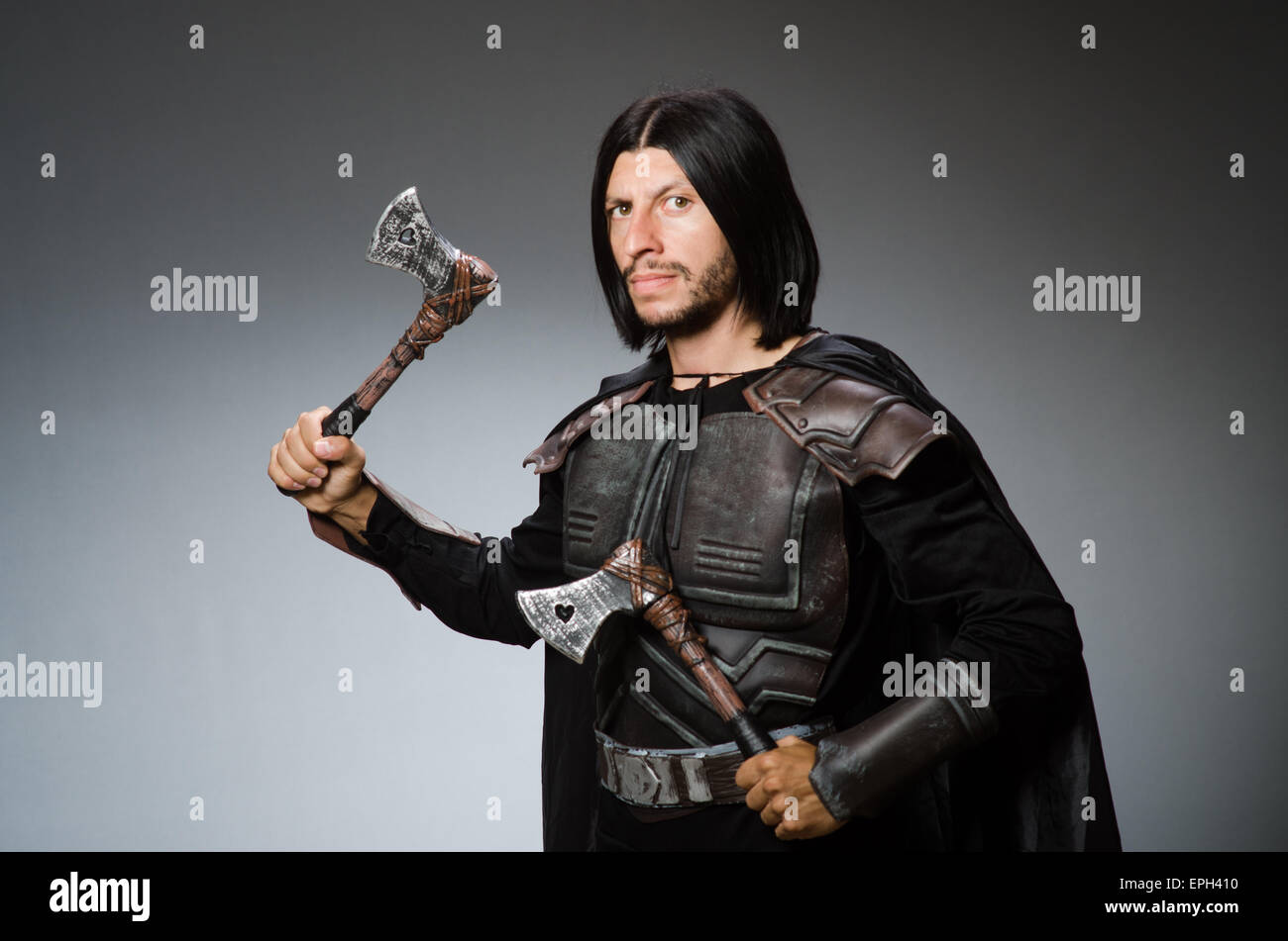 Knight with axe against dark background Stock Photo - Alamy