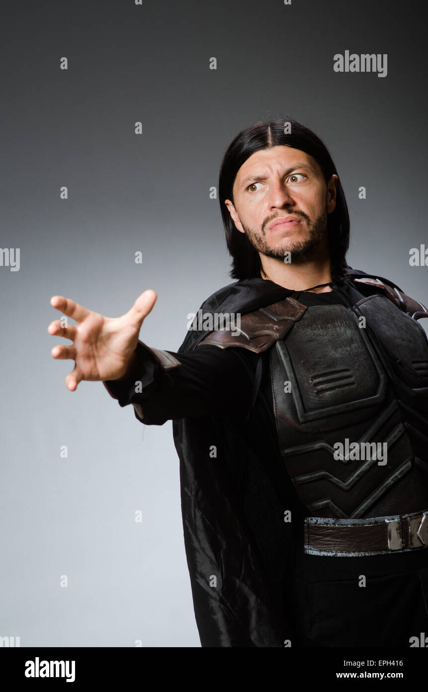 Angry warrior against dark background Stock Photo - Alamy