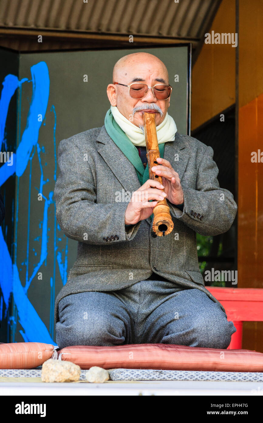 Old man playing flute in hi-res stock photography and images - Alamy