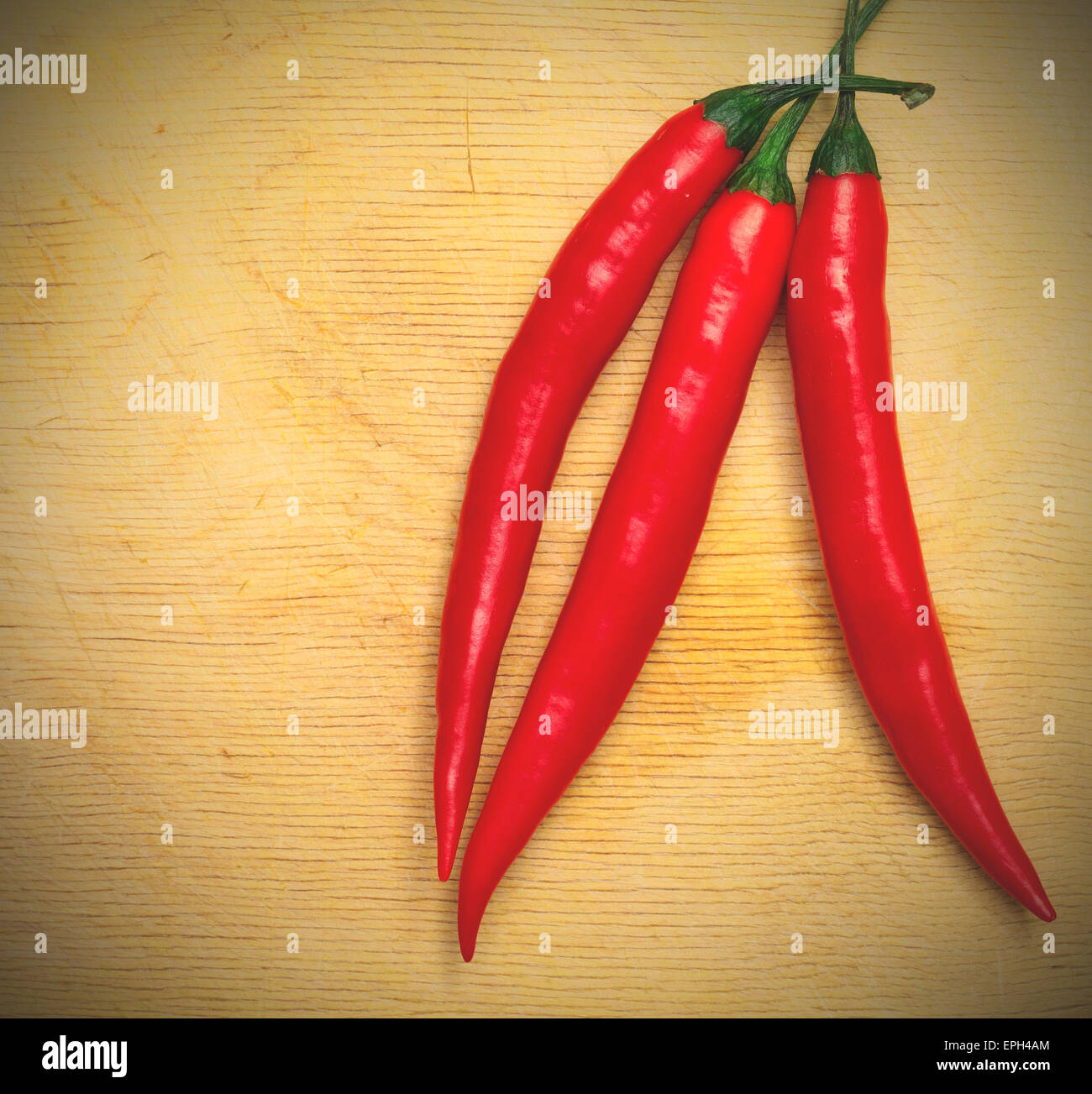 three red hot chili peppers Stock Photo - Alamy