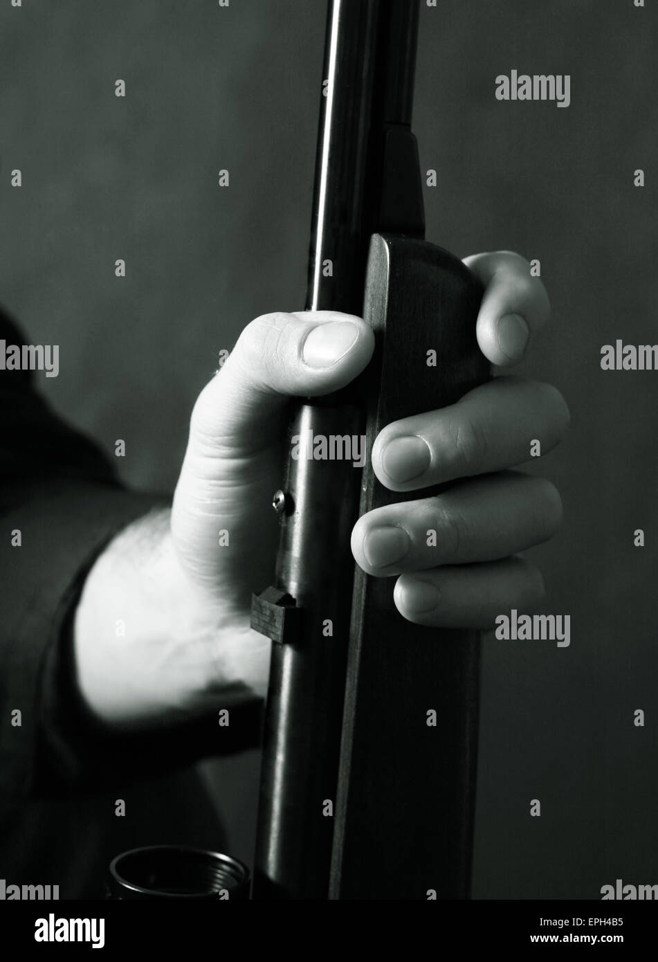 Gun in a hand Stock Photo - Alamy