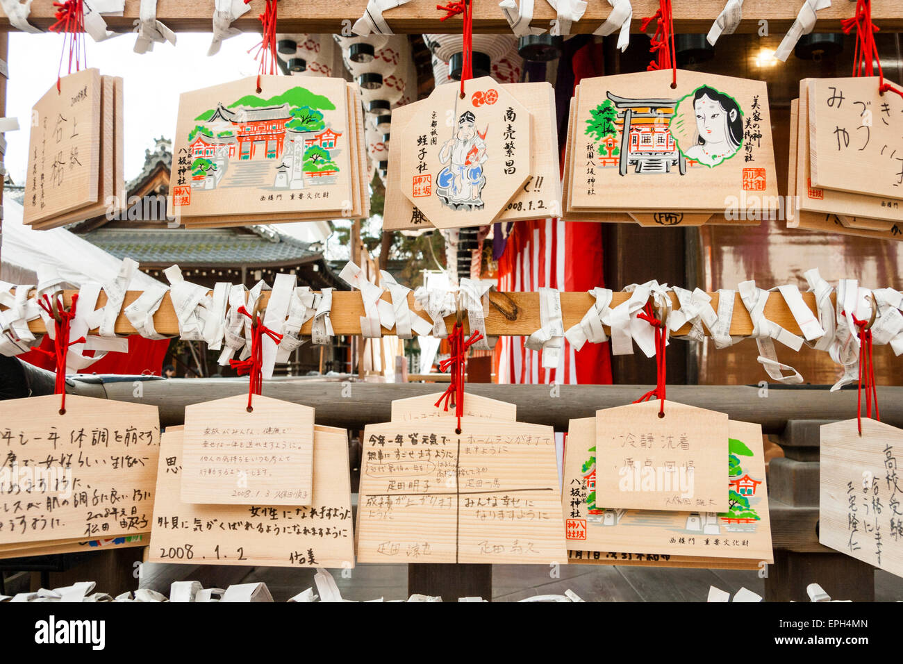 Japanese ema boards, wishing tablets, hanging from frame work by red ...