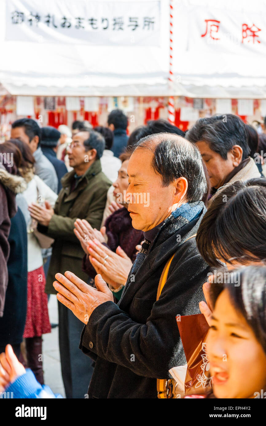 New year in Japan. Many people in front of the main stage of the hall ...