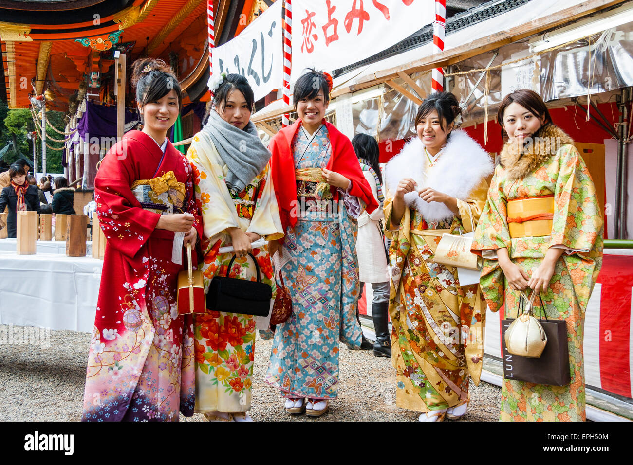 Five young Japanese women posing for viiewer, laughing and smiling ...