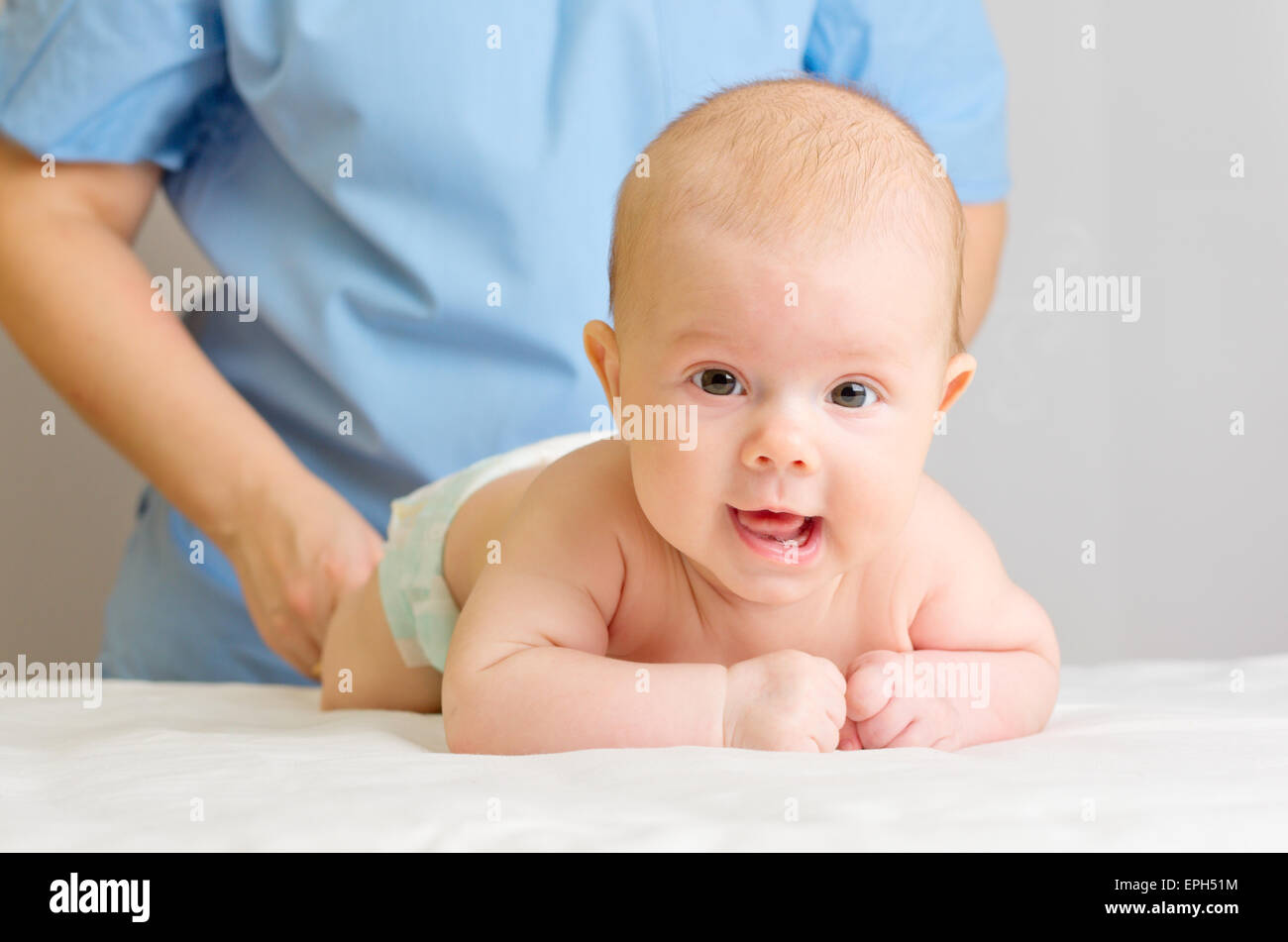 Little baby girl with doctor Stock Photo - Alamy