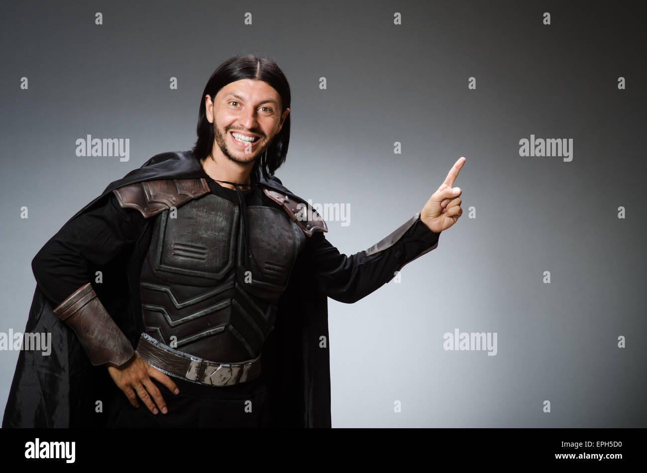 Funny knight against dark background Stock Photo - Alamy