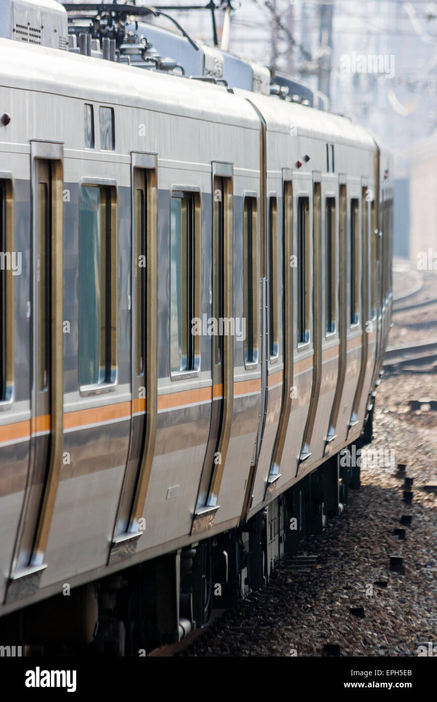 Japan. Japanese Railways, JR, Communter train, passing by. A 321 series ...