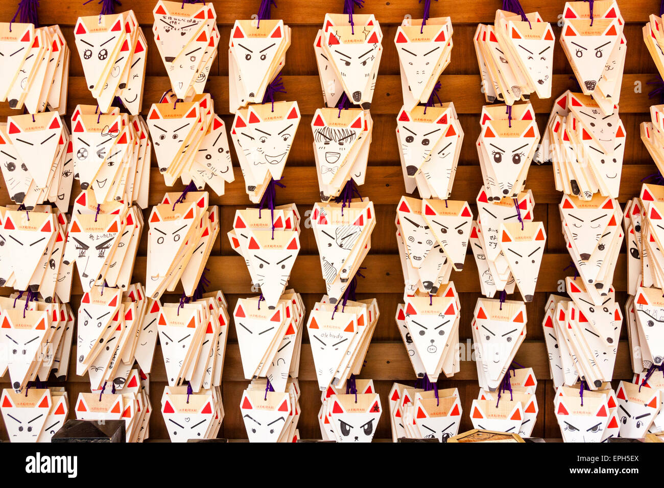 Five rows of ema boards hanging on wooden strips on framework at the ...