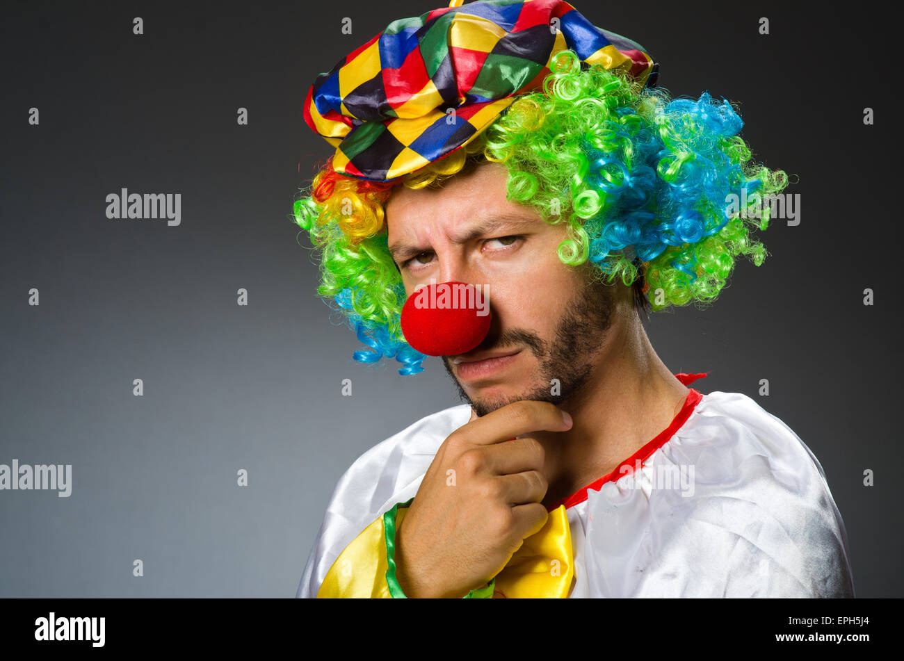 Funny clown in colourful costume Stock Photo - Alamy