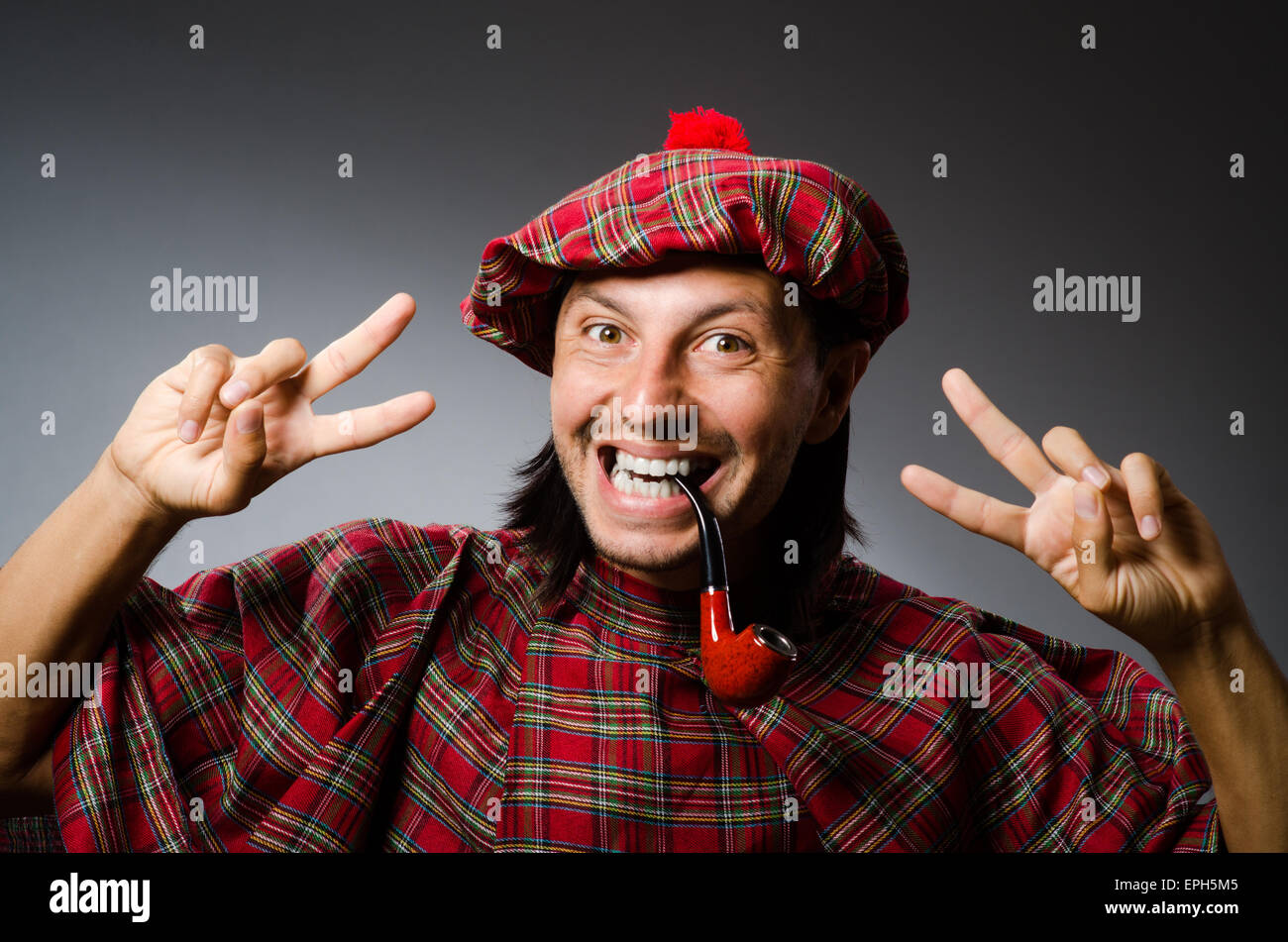 Funny scotsman with smoking pipe Stock Photo - Alamy