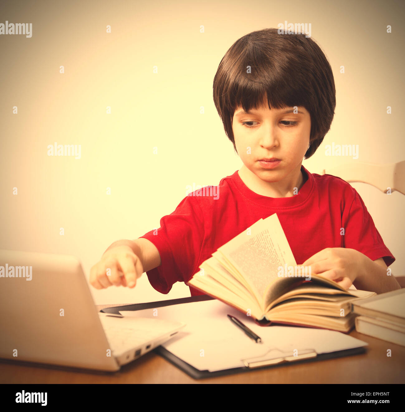 schoolboy doing homework Stock Photo - Alamy