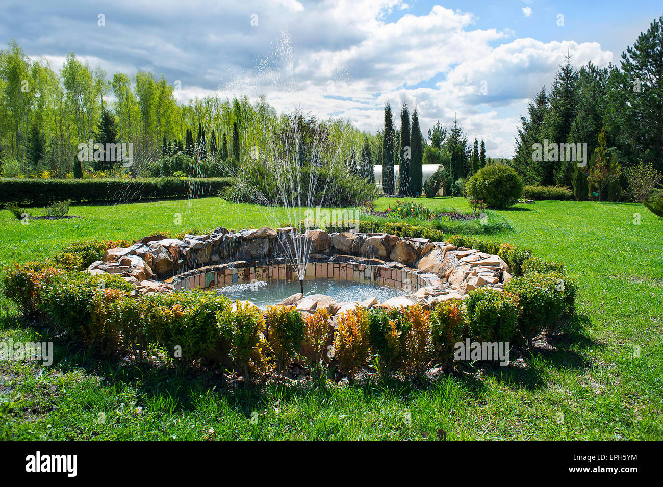 Fountain in the park bright sunny day Stock Photo - Alamy