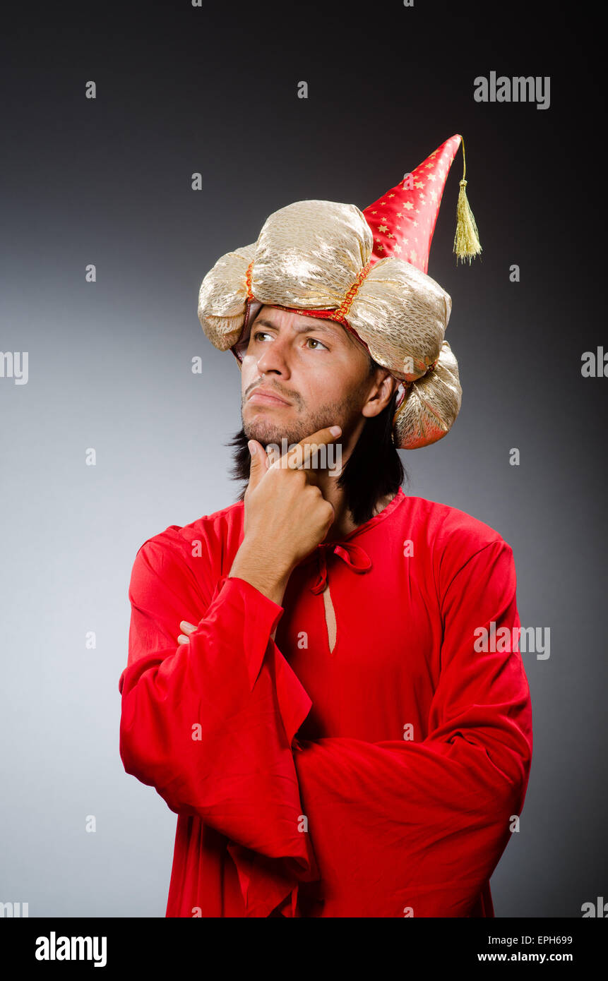 Funny wizard wearing red dress Stock Photo - Alamy