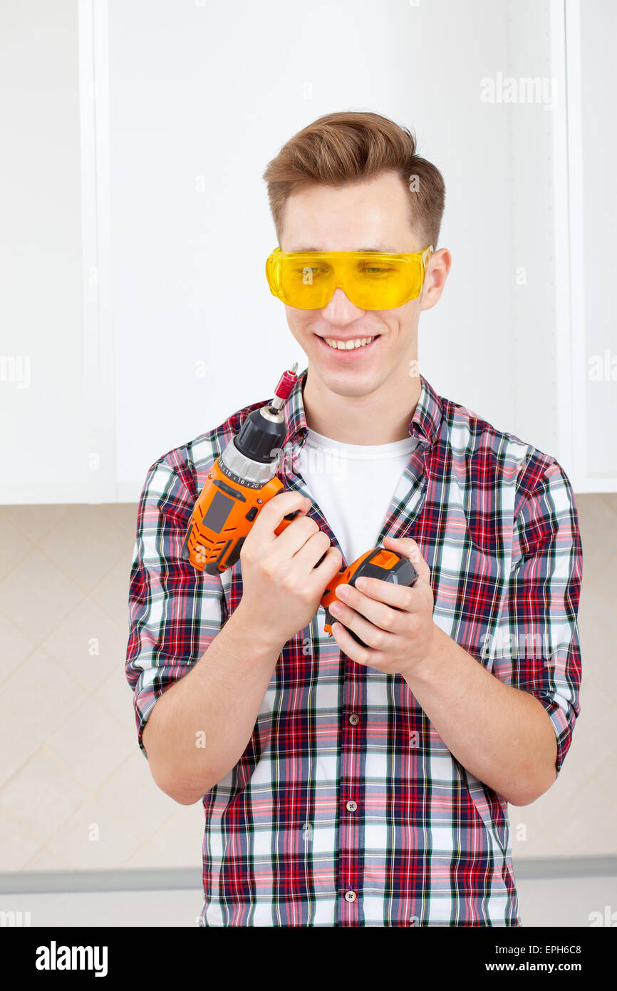 Handsome friendly guy repairman hi-res stock photography and images - Alamy