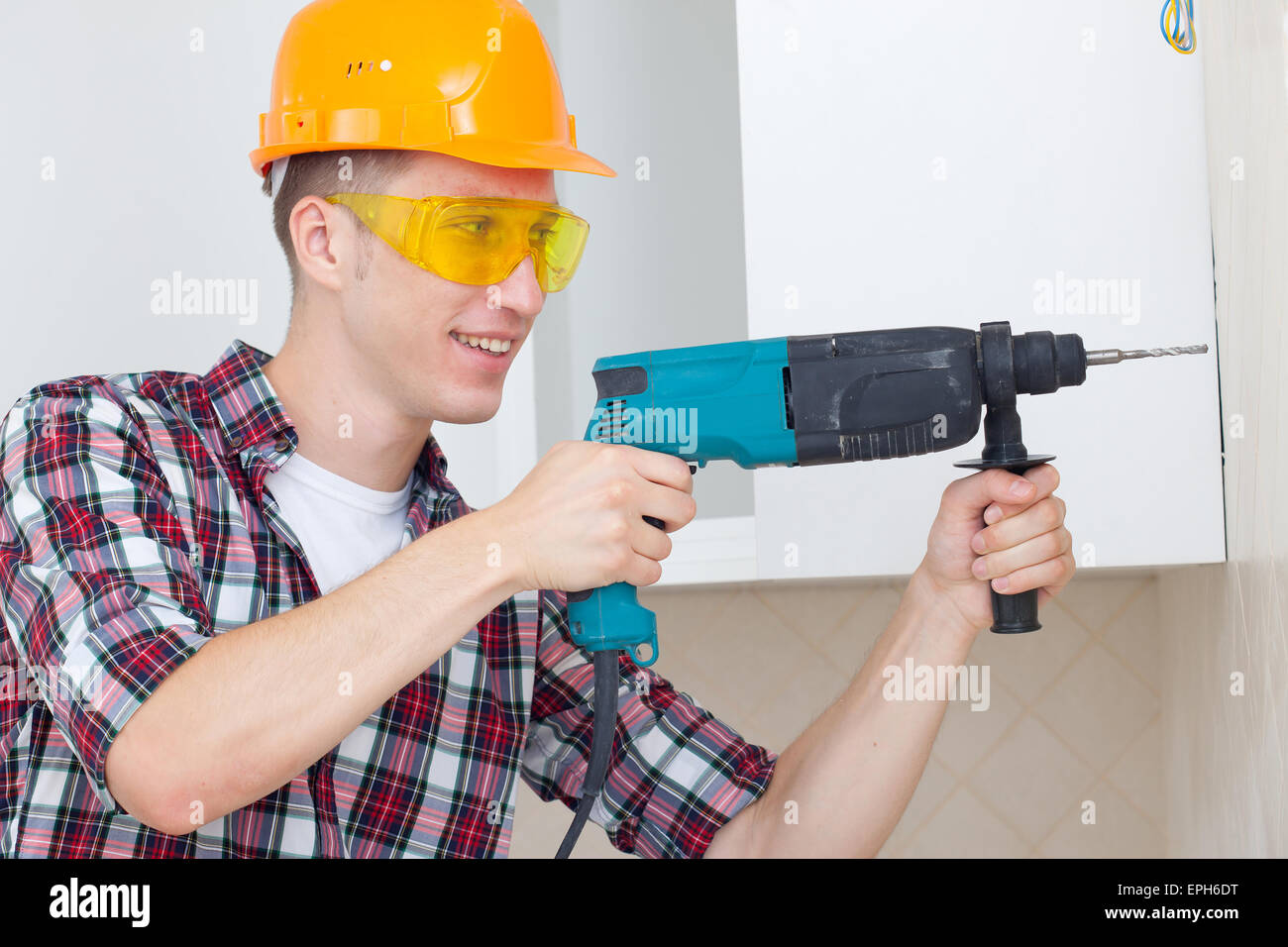 smiling worker with rock-drill Stock Photo - Alamy