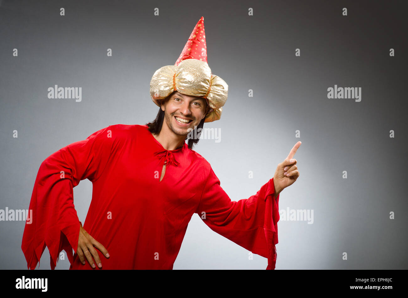 Funny wizard wearing red dress Stock Photo - Alamy