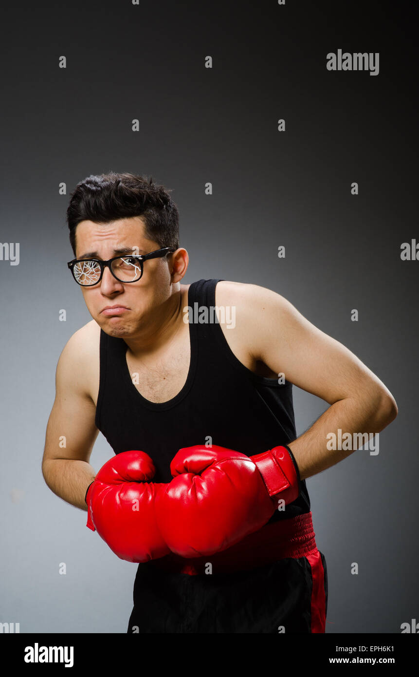 Funny boxer with red gloves against dark background Stock Photo - Alamy