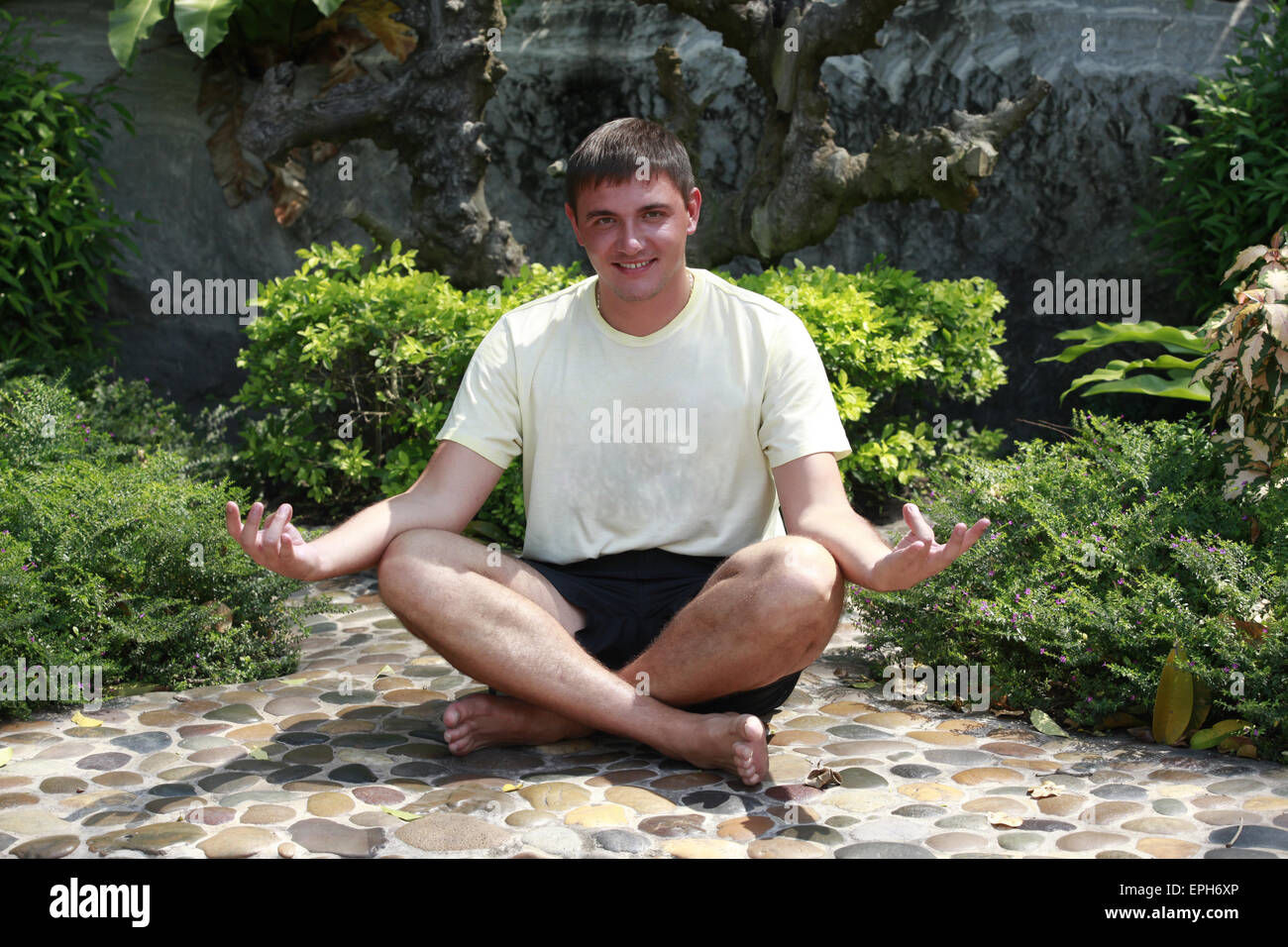 Guy meditating hi-res stock photography and images - Alamy