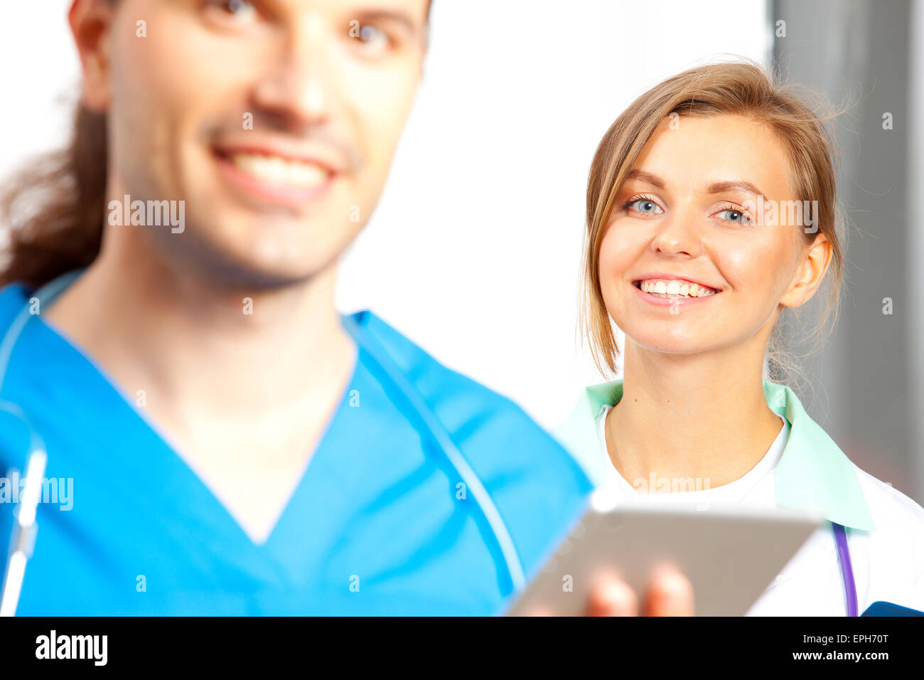 Happy team young doctors hi-res stock photography and images - Alamy