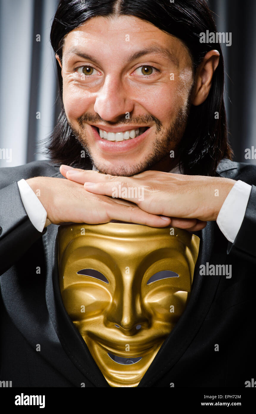 Funny concept with theatrical mask Stock Photo - Alamy