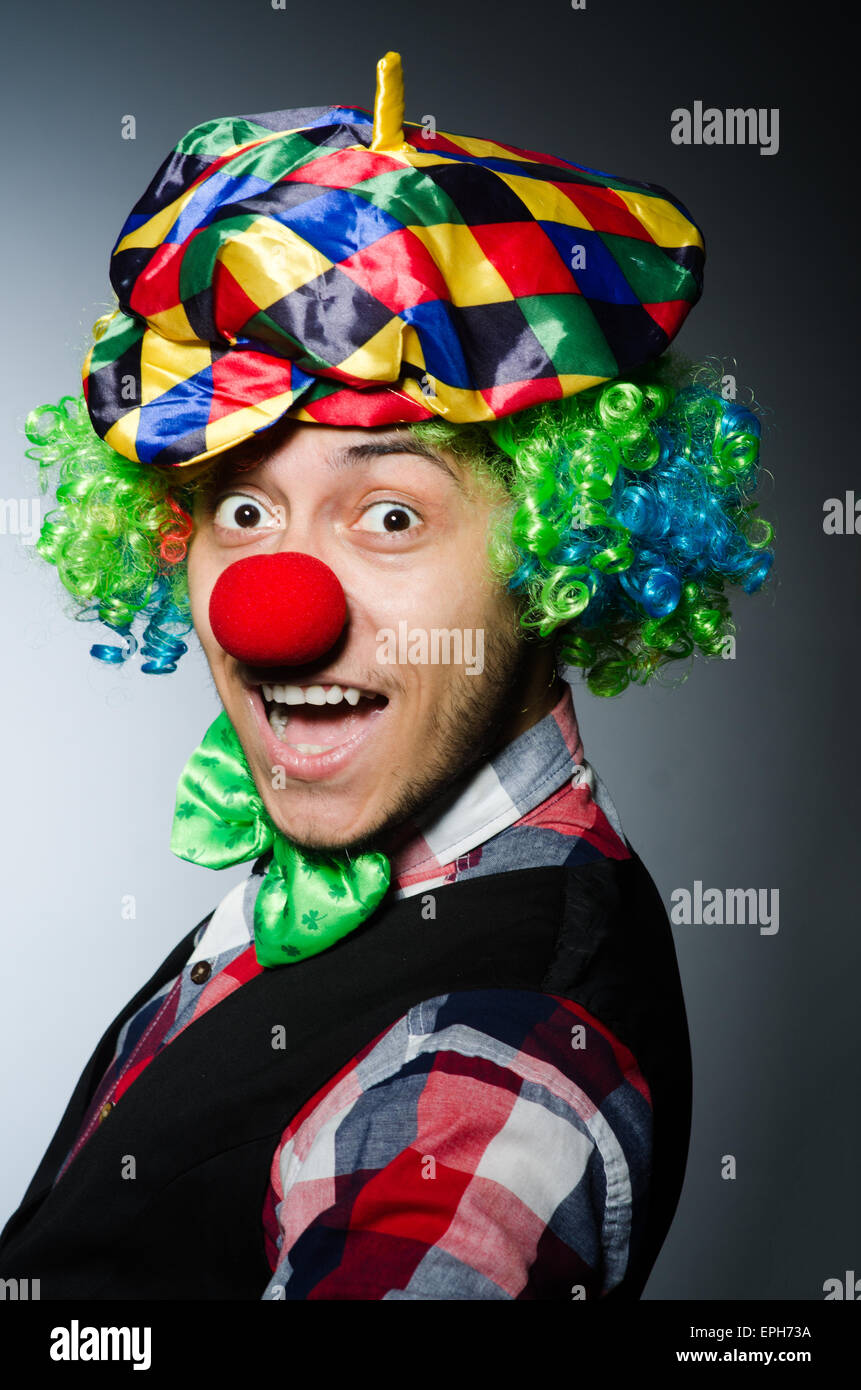 Funny clown against the dark background Stock Photo - Alamy