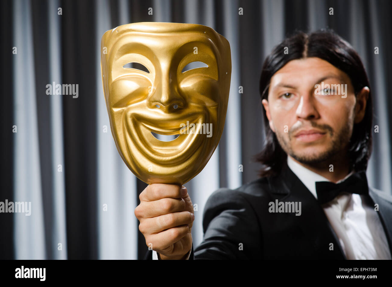 Funny concept with theatrical mask Stock Photo - Alamy
