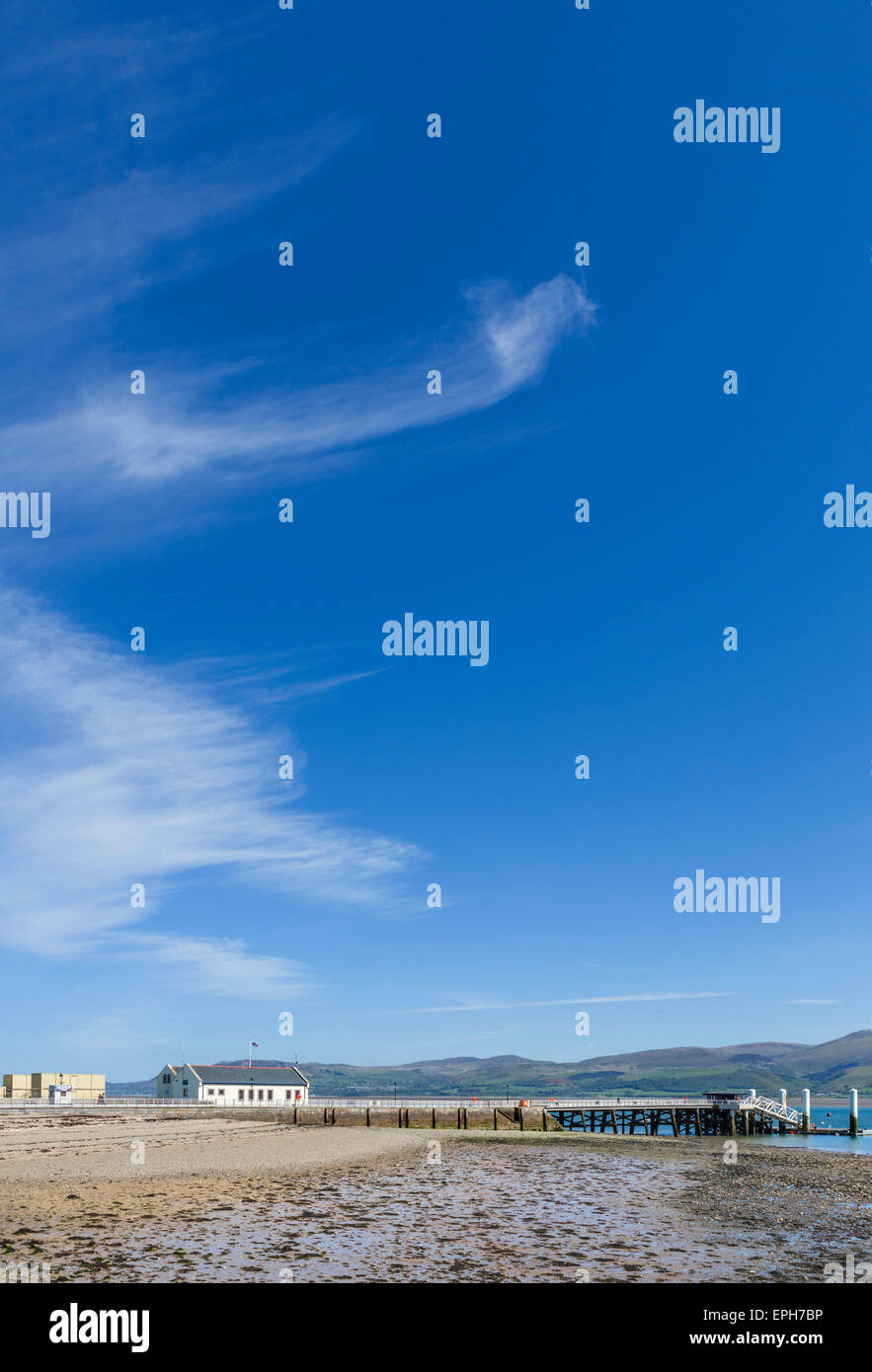 The pier in Beaumaris looking over the Menai Strait to Snowdonia in the ...