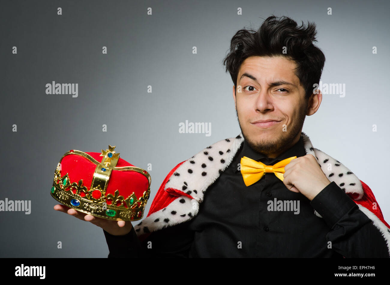 Concept with funny man wearing crown Stock Photo - Alamy