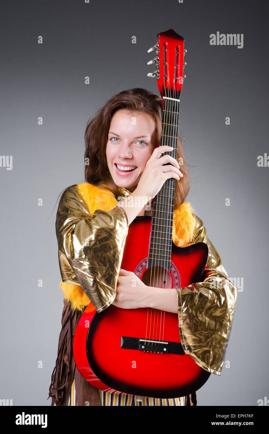 Guitar player with red instrument Stock Photo - Alamy