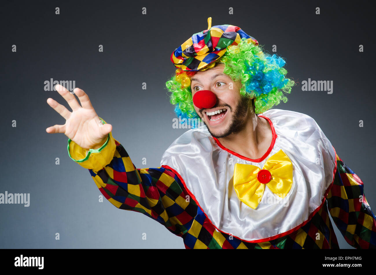 Funny clown in colourful costume Stock Photo - Alamy