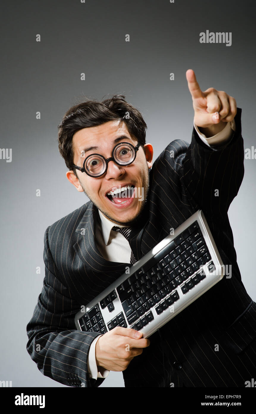 Comouter geek with computer keyboard Stock Photo - Alamy