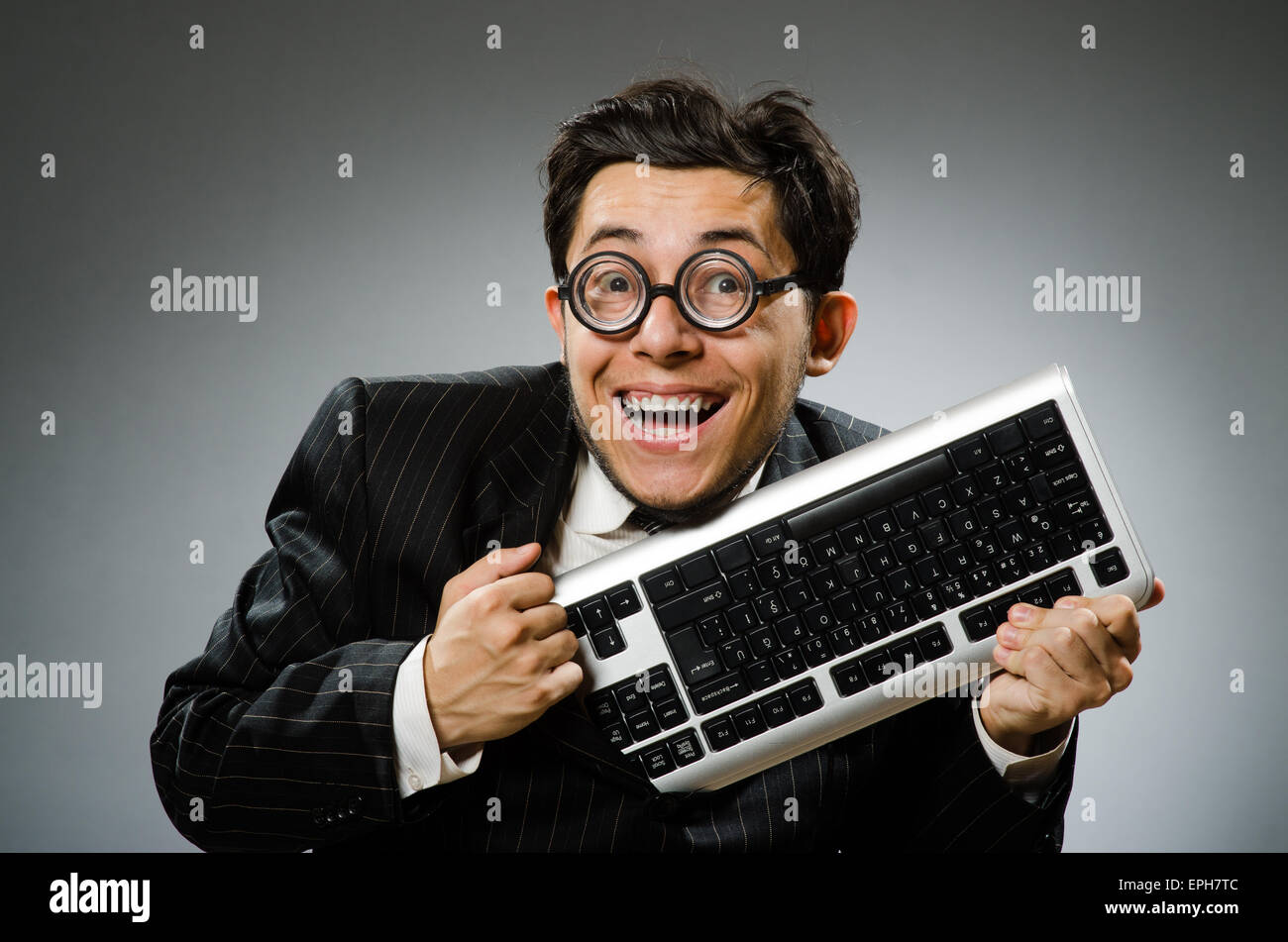 Comouter geek with computer keyboard Stock Photo - Alamy