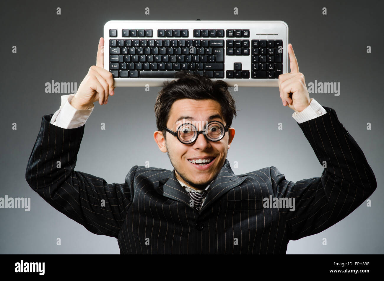 Comouter geek with computer keyboard Stock Photo - Alamy