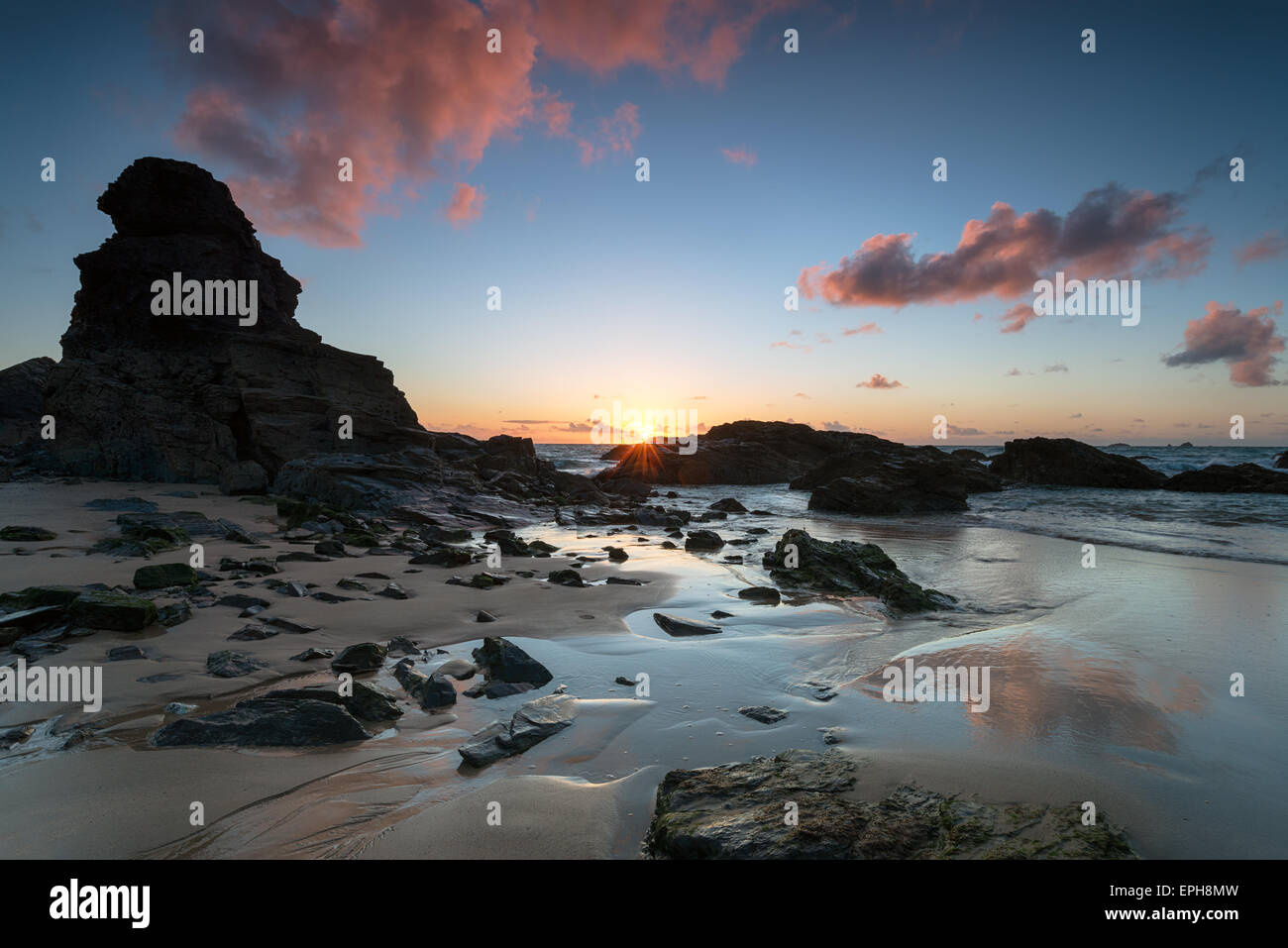 Giant sea stacks at low tide on the beach at Porthcothan Bay on the ...