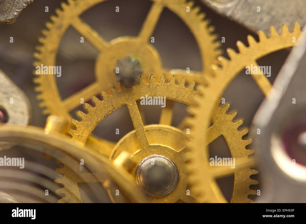 Background with golden metal cogwheels inside clockwork. Conceptual ...