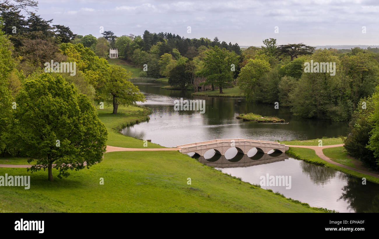 Bridge over river with small folly in the distance Stock Photo - Alamy