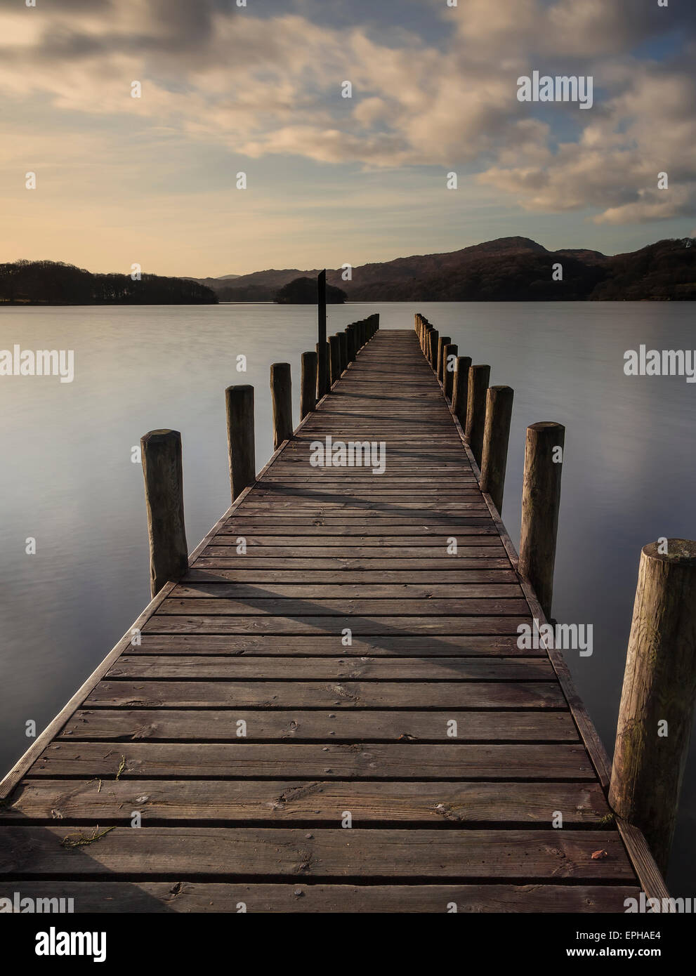 Jetty on Coniston Water, Lake District, Cumbria, at dusk Stock Photo ...
