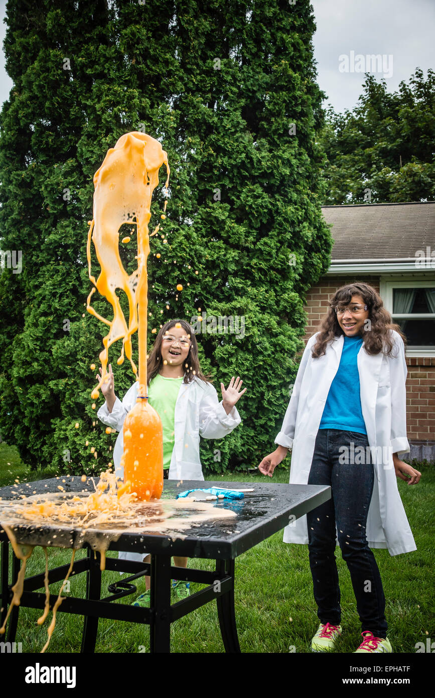 Two teenage girls experiment with combination of Mentos and sodas ...