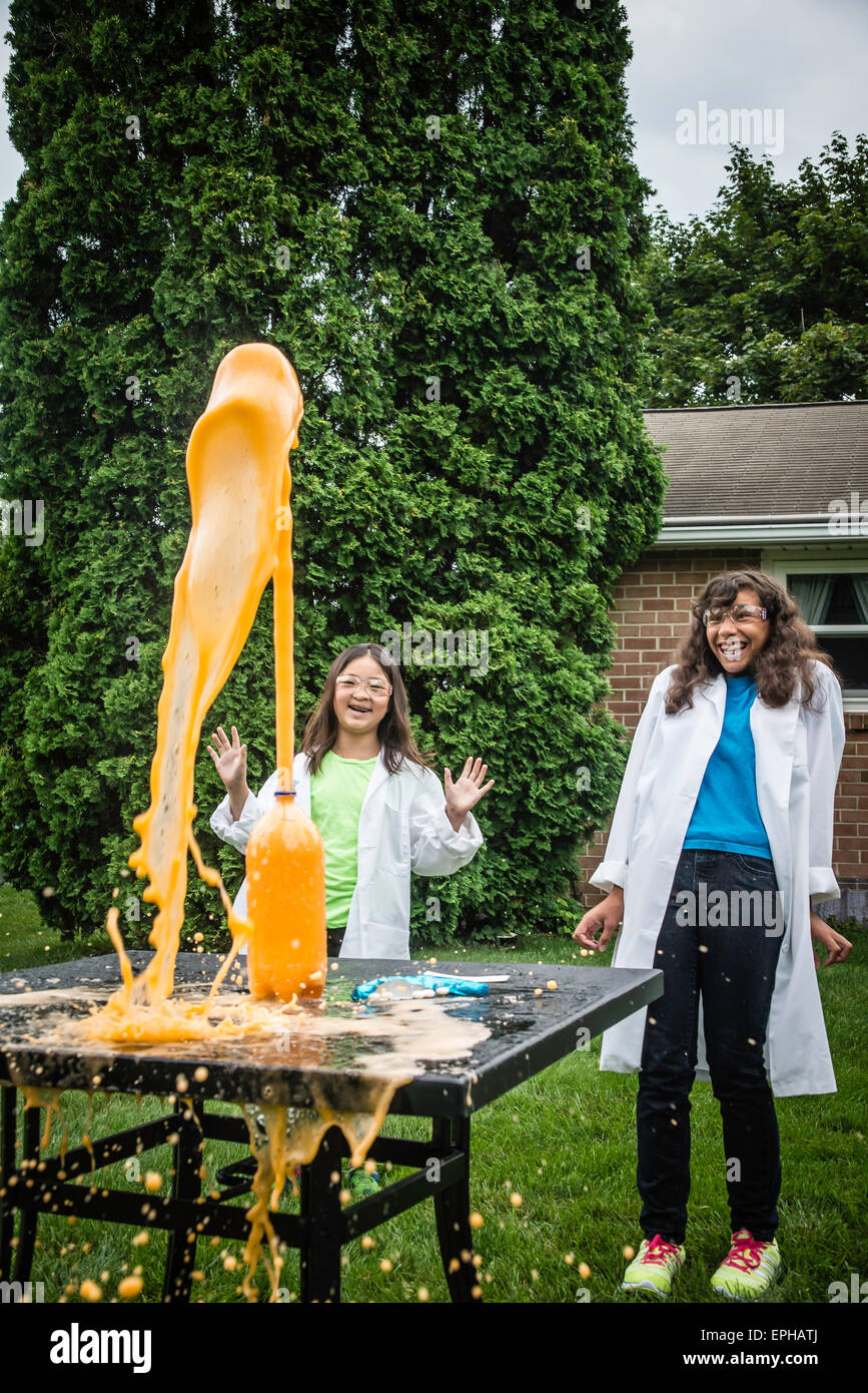 Two teenage girls experiment with combination of Mentos and sodas ...