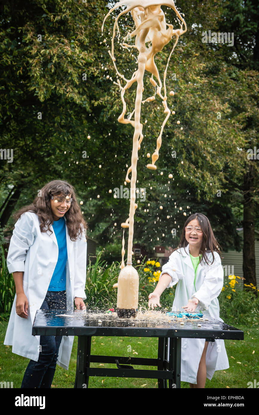 Two teenage girls experiment with combination of Mentos and sodas ...