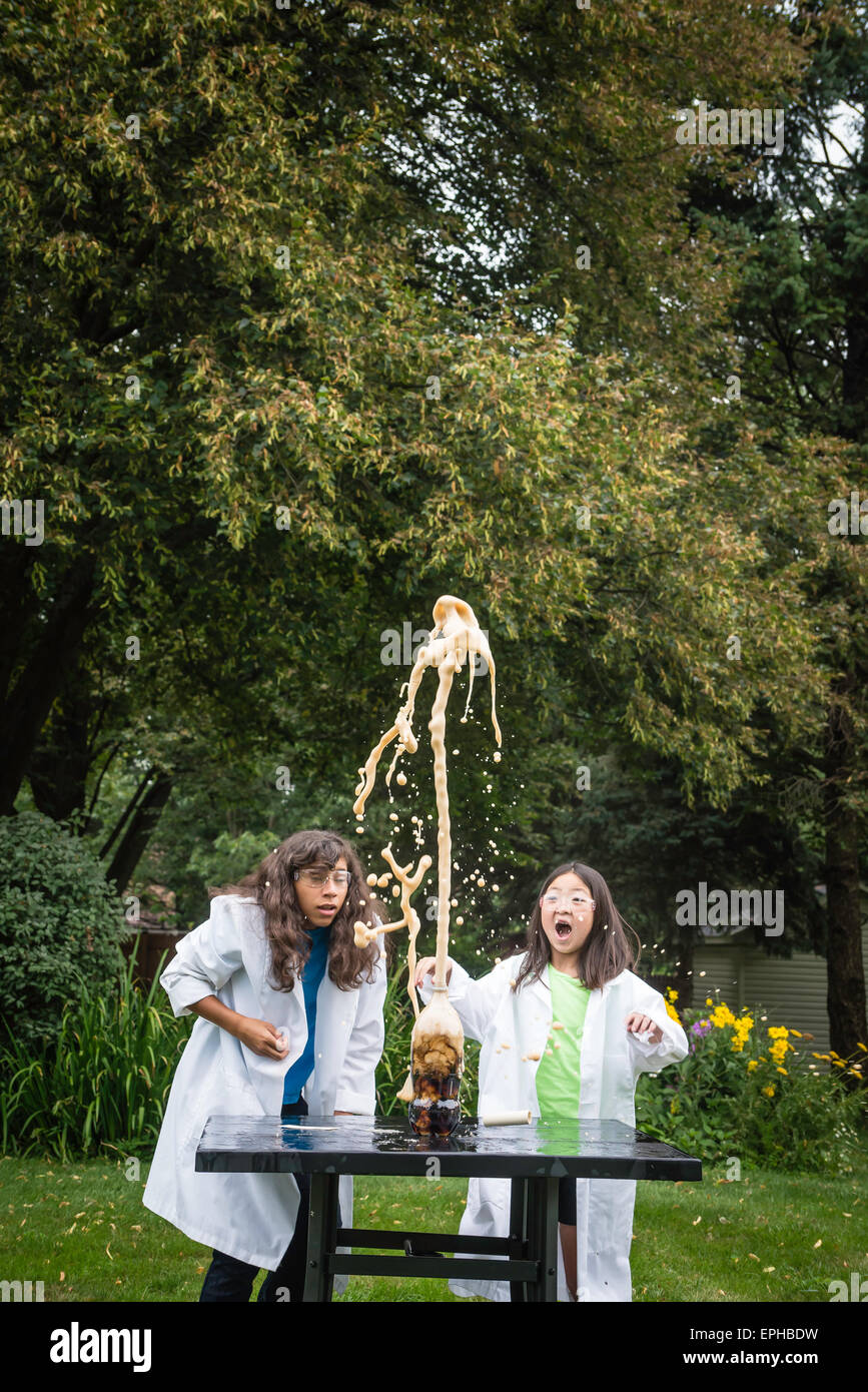 Two teenage girls experiment with combination of Mentos and sodas ...