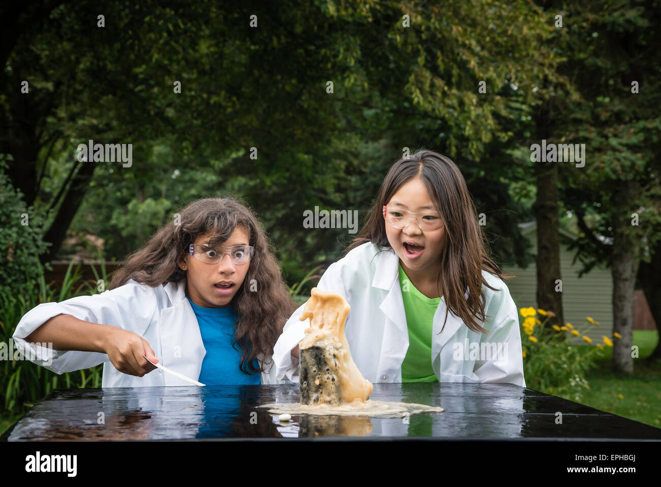 Two teenage girls experiment with combination of Mentos and sodas ...