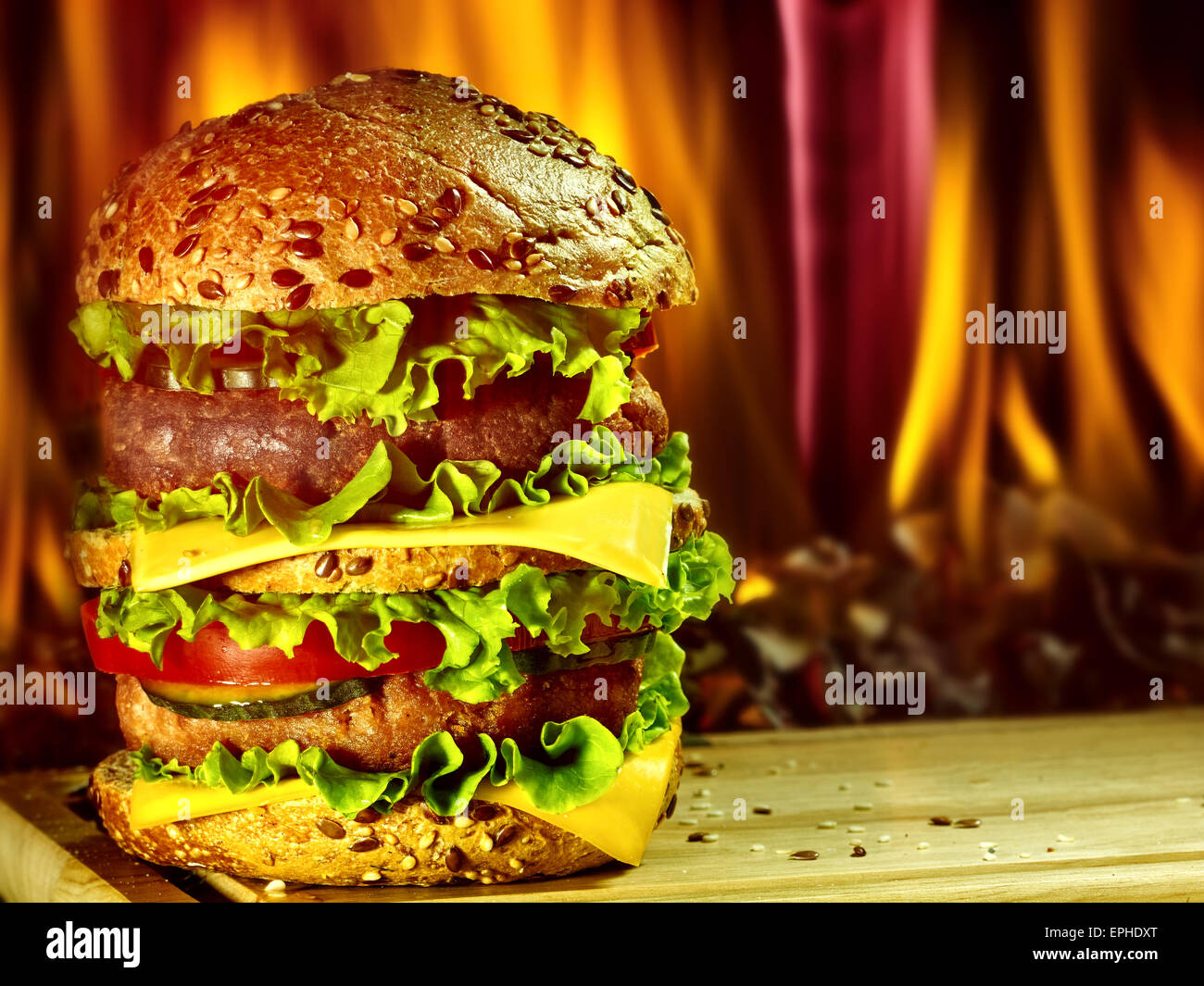 Hamburger fire flame cheeseburger hi-res stock photography and images ...