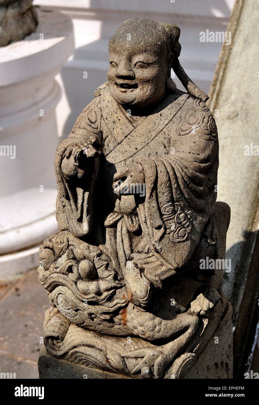 Bangkok, Thailand: Carved stone statue of a Chinese nobleman on a stair ...